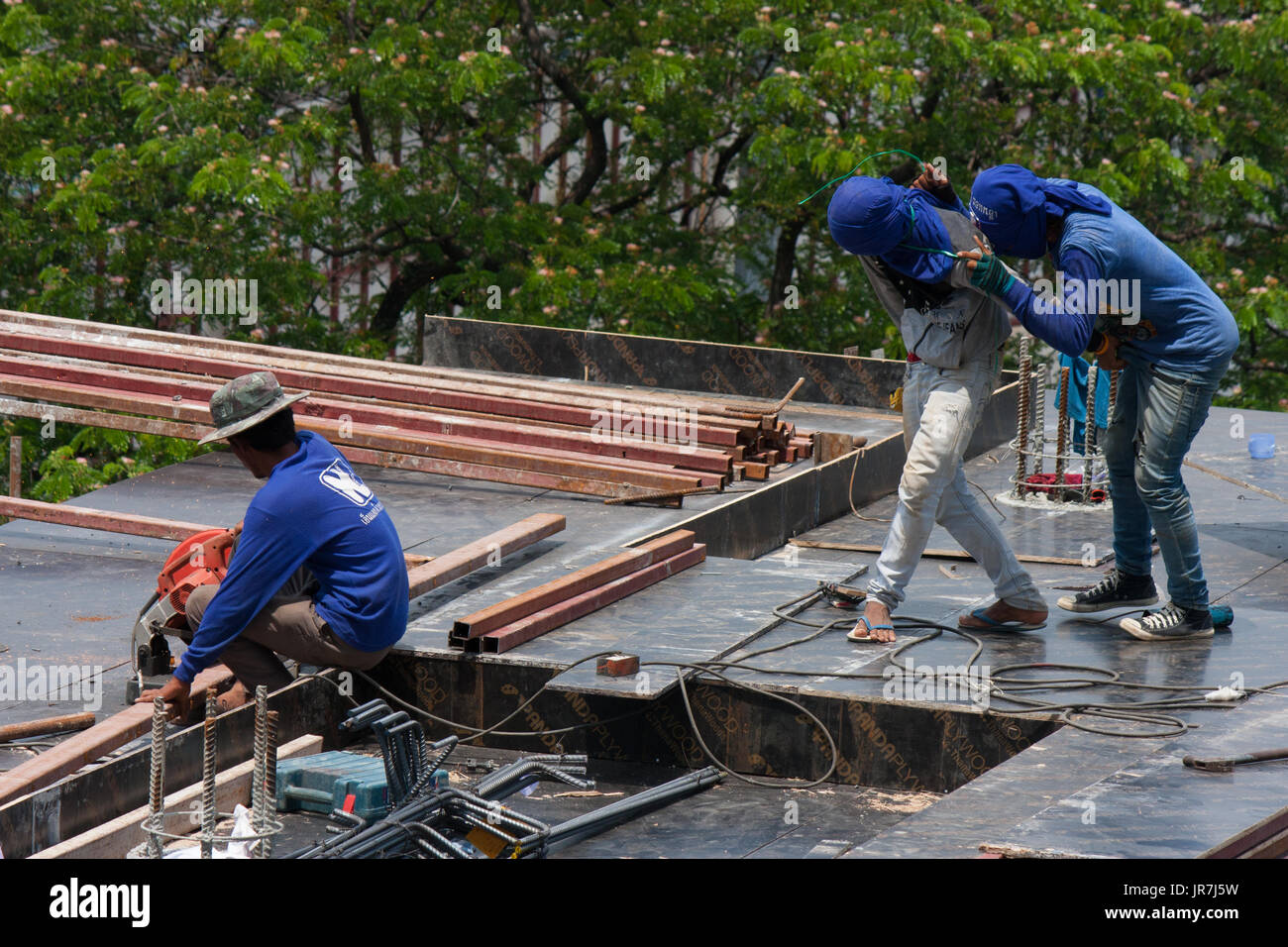 Two workers are playing on the construction site of the "Commons" in ...