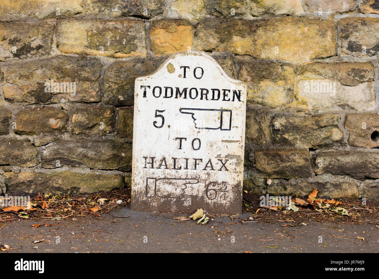 An traditional stone milestone marker in Haden Bridge, West Yorkshire ...