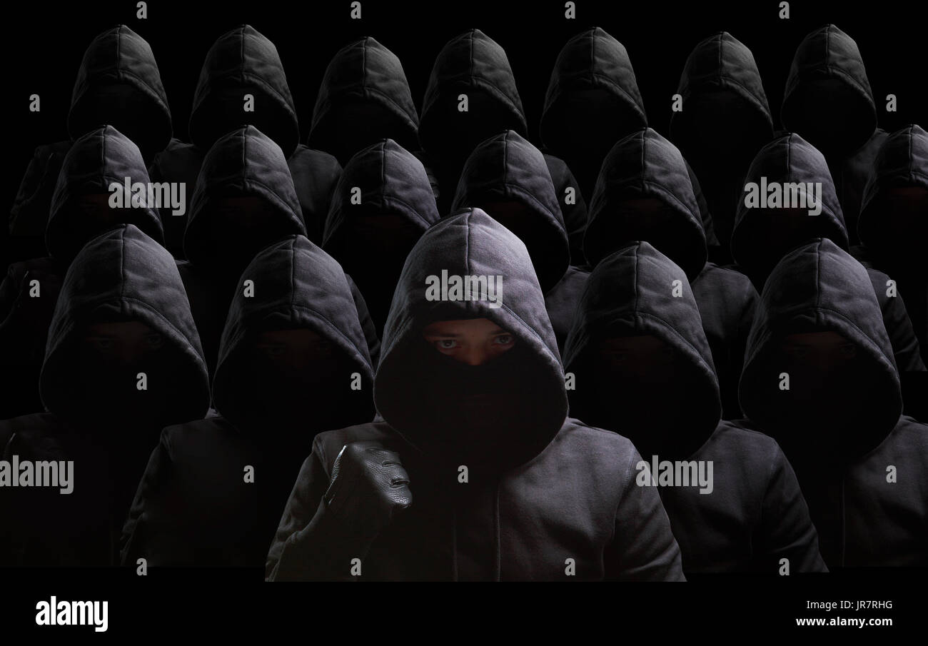 Many thieves on black background Stock Photo - Alamy