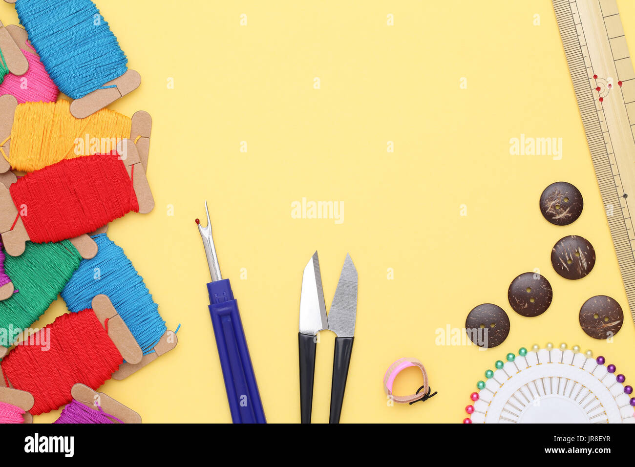 sewing tools, tailoring and fashion concept - close-up on yellow ...