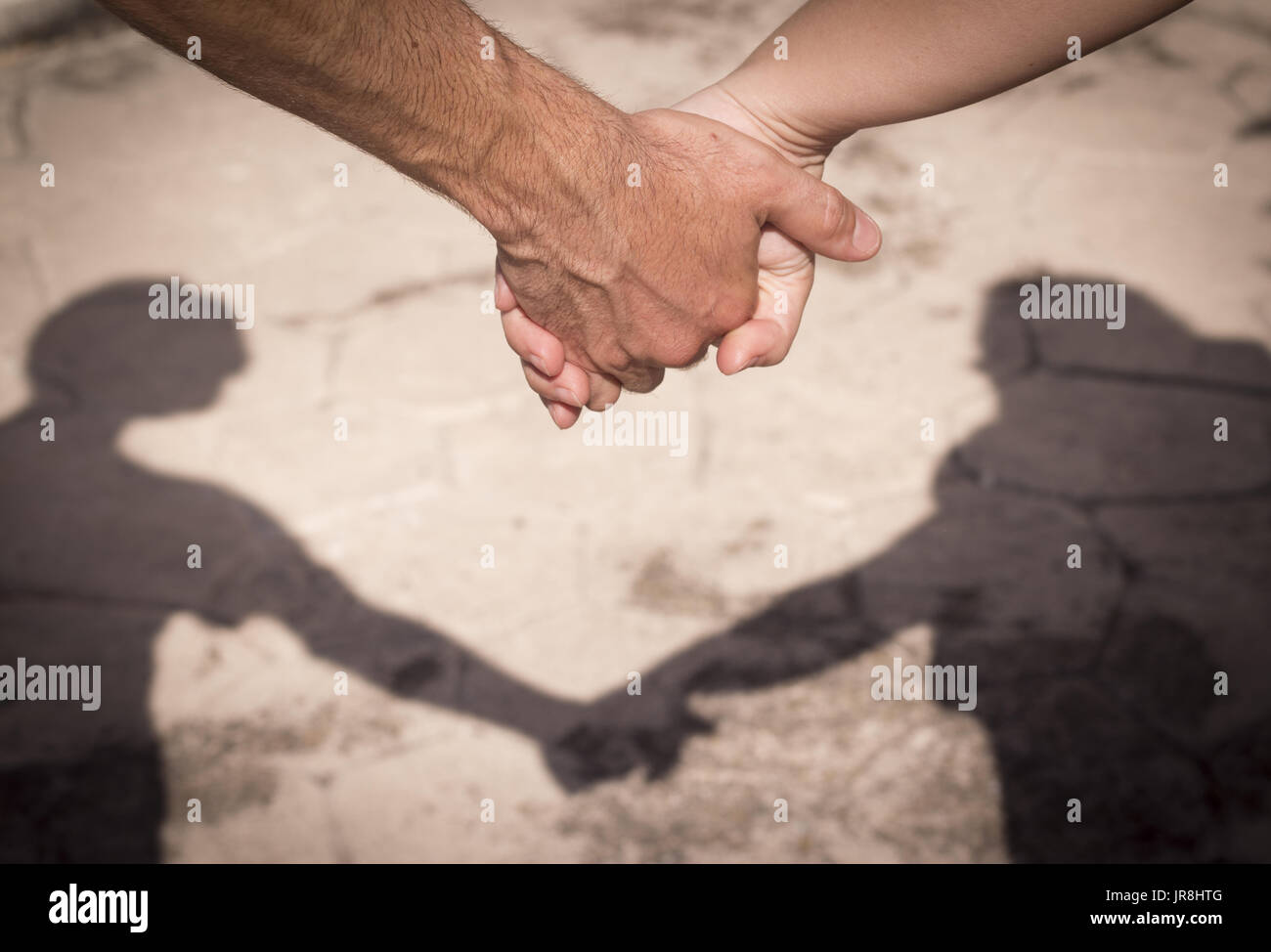 Intertwined hands and arms hi-res stock photography and images - Alamy