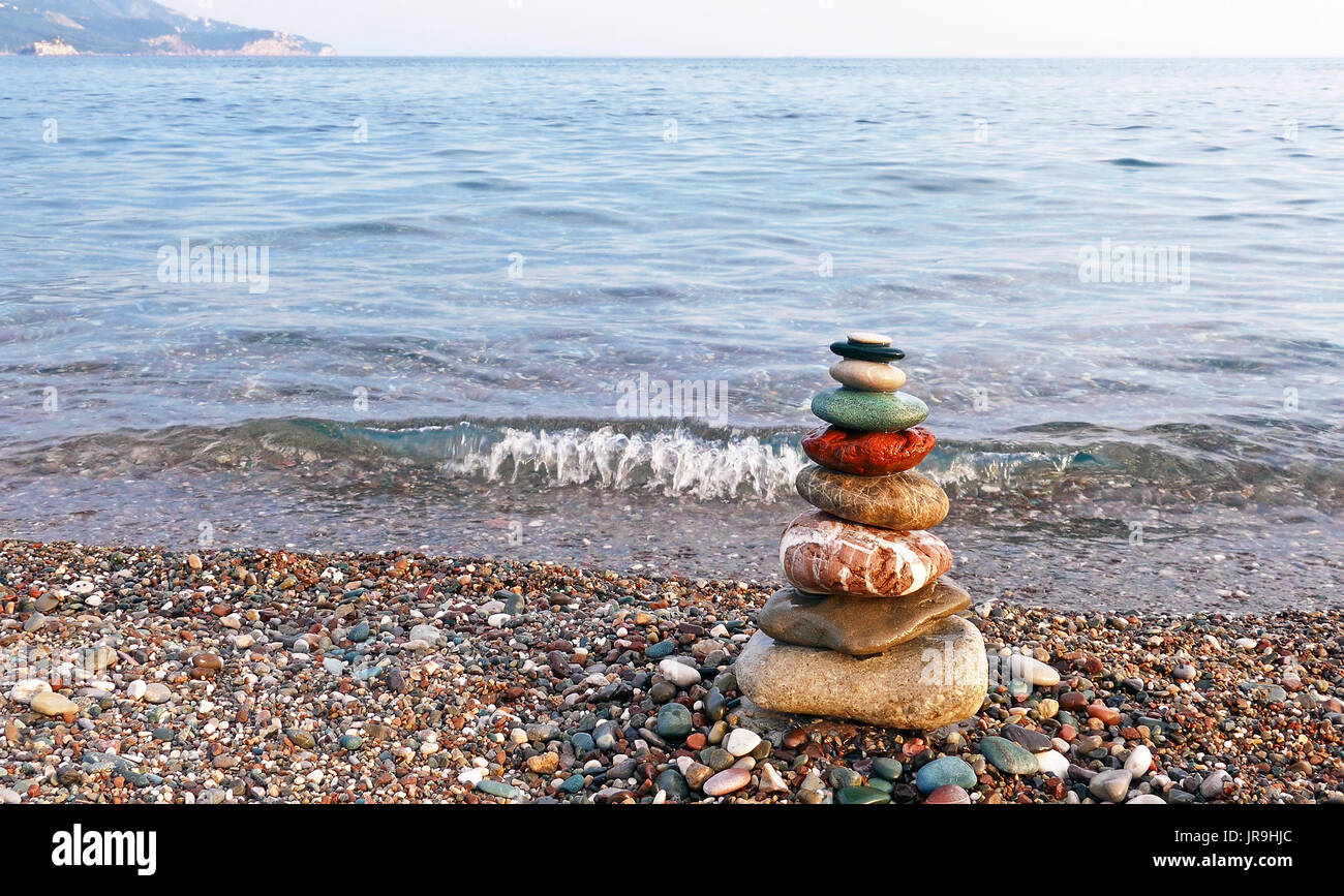 Stones balance on the beach at sunset. Concept of peace and harmony ...