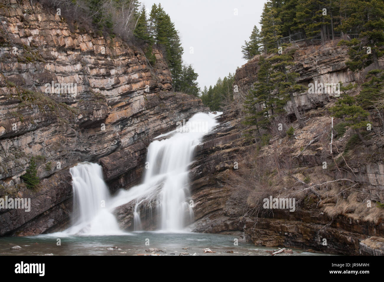 A beautiful waterfall with a soft flow of water creating a dreamy look ...