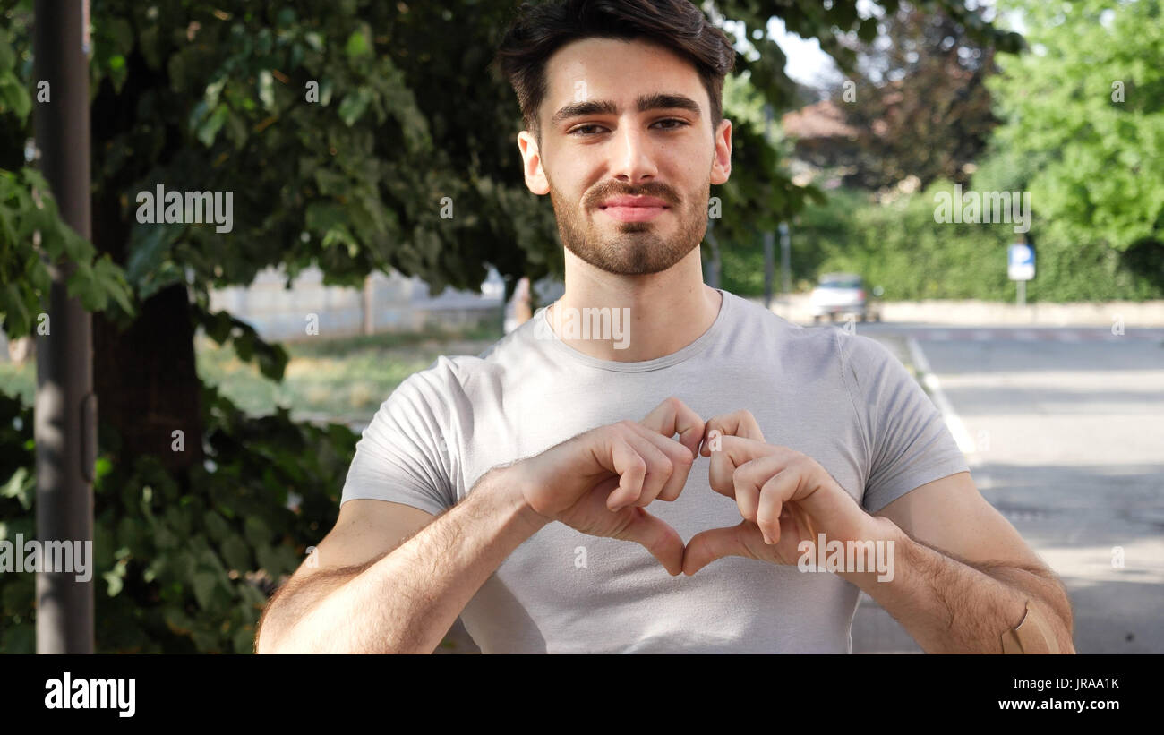 Heart sign hands young man hi-res stock photography and images - Alamy