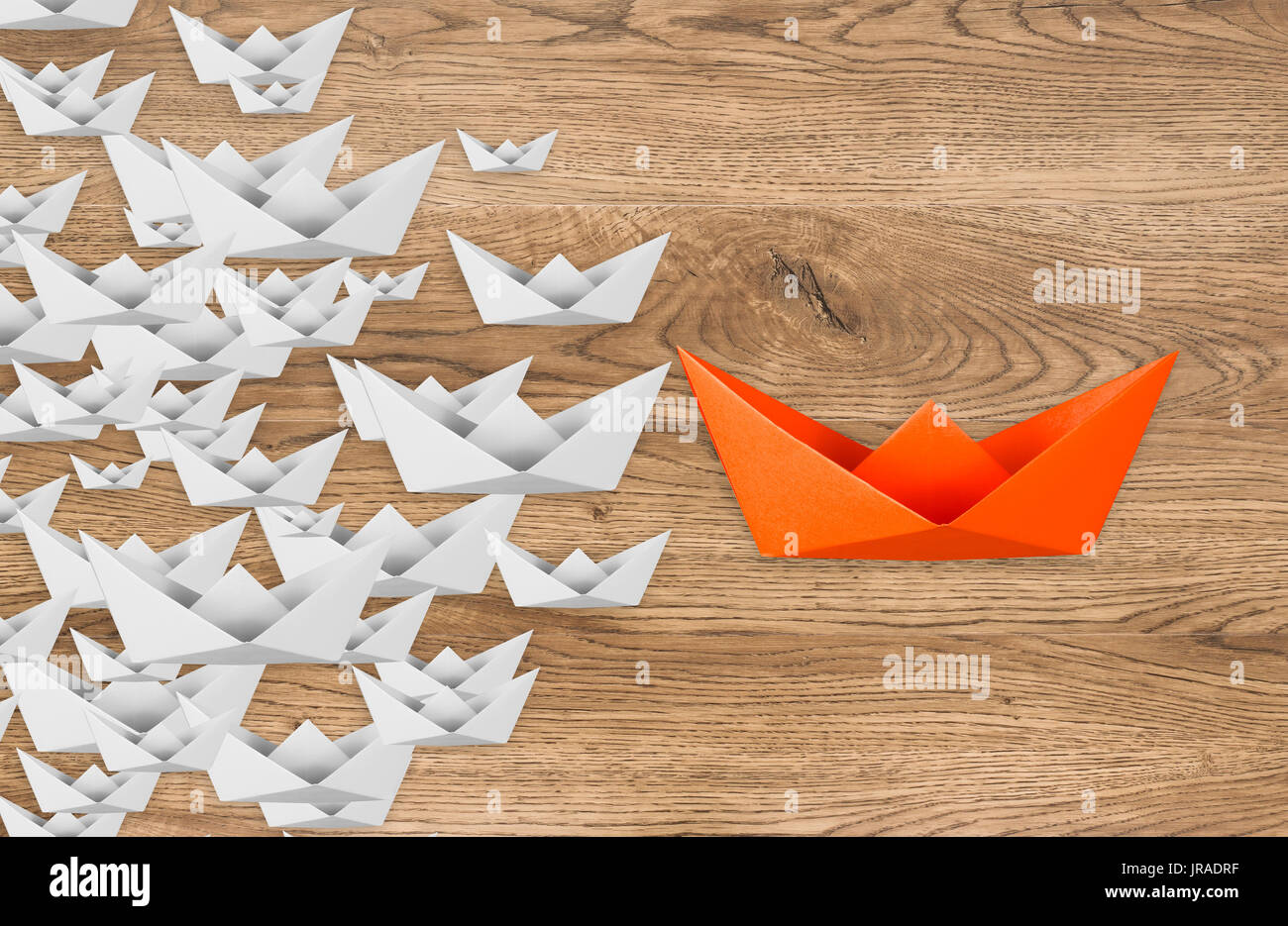 leadership concept with paper boat leading Stock Photo - Alamy