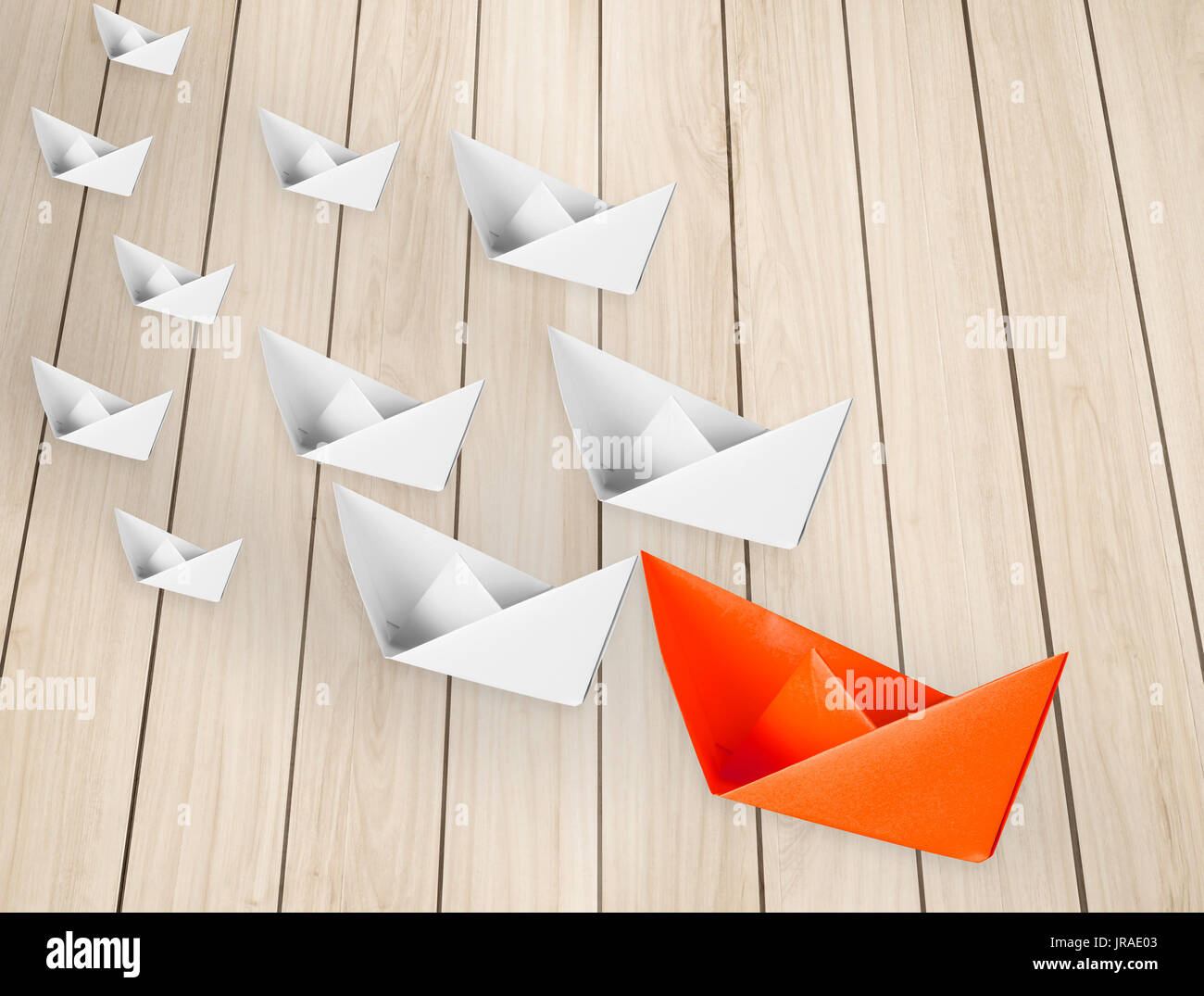leadership concept with paper boat leading Stock Photo - Alamy