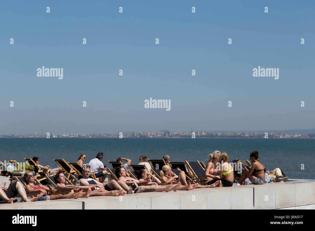 Adult sunbathers hi-res stock photography and images - Alamy