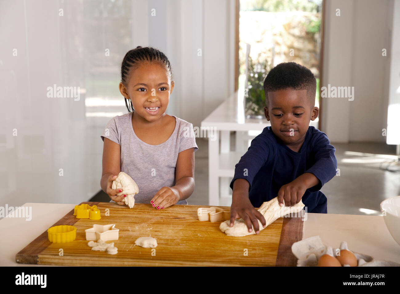 brother and sister making cookies Stock Photo - Alamy