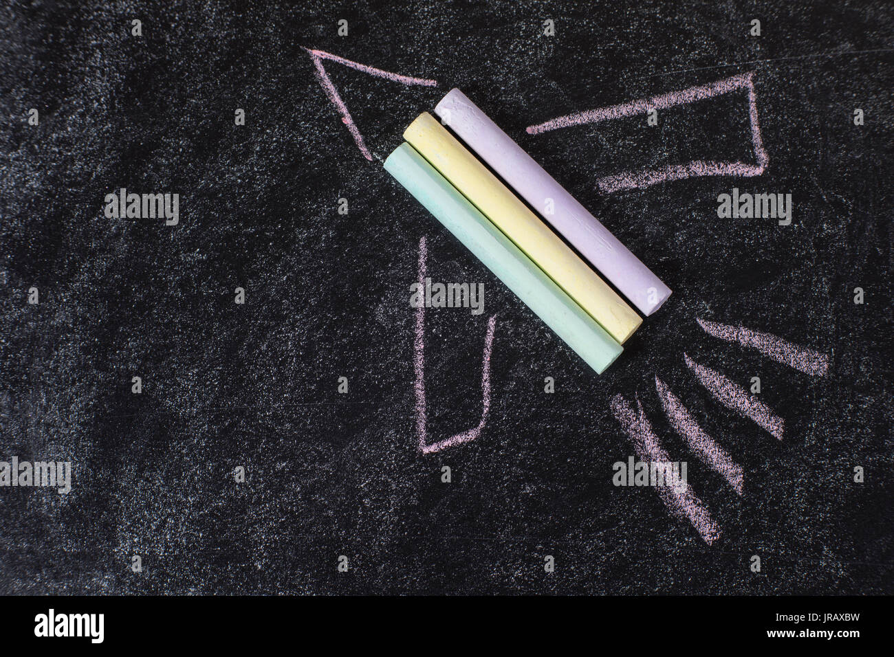 Pieces of chalk arranged in space rocket against blackboard Stock Photo ...