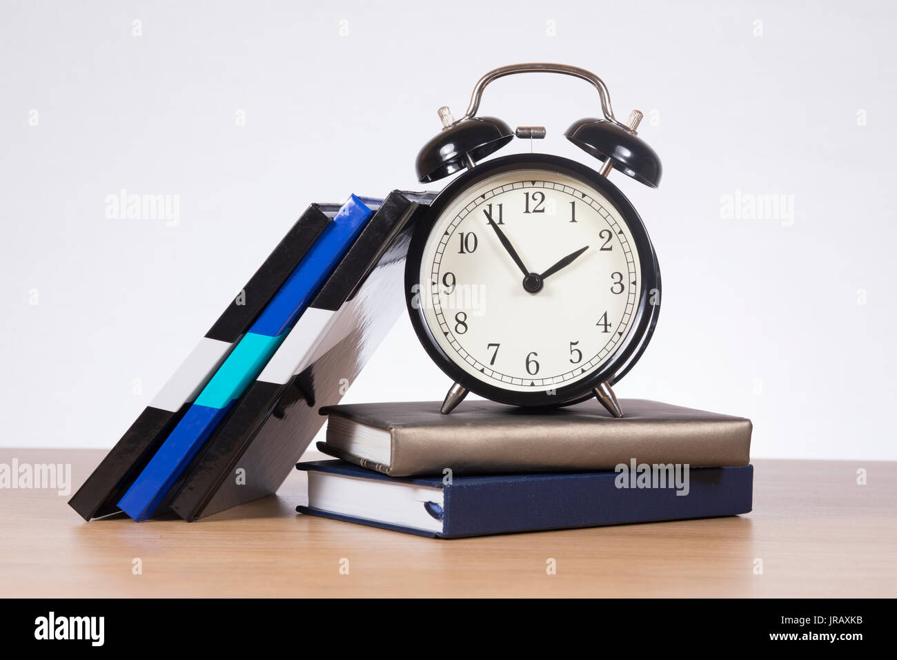 Time to resume work after lunch concept with a retro alarm clock ...