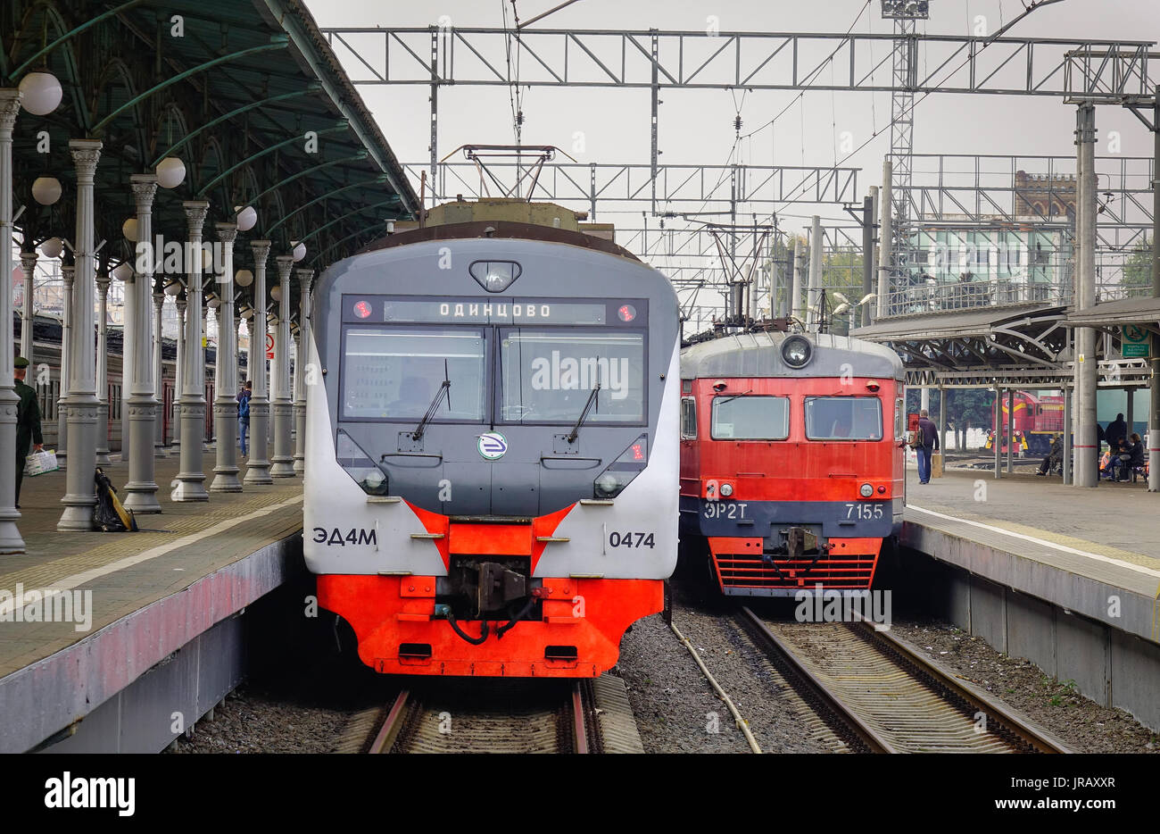 Moscow, Russia - Oct 3, 2016. Red trains stop at railway station in ...