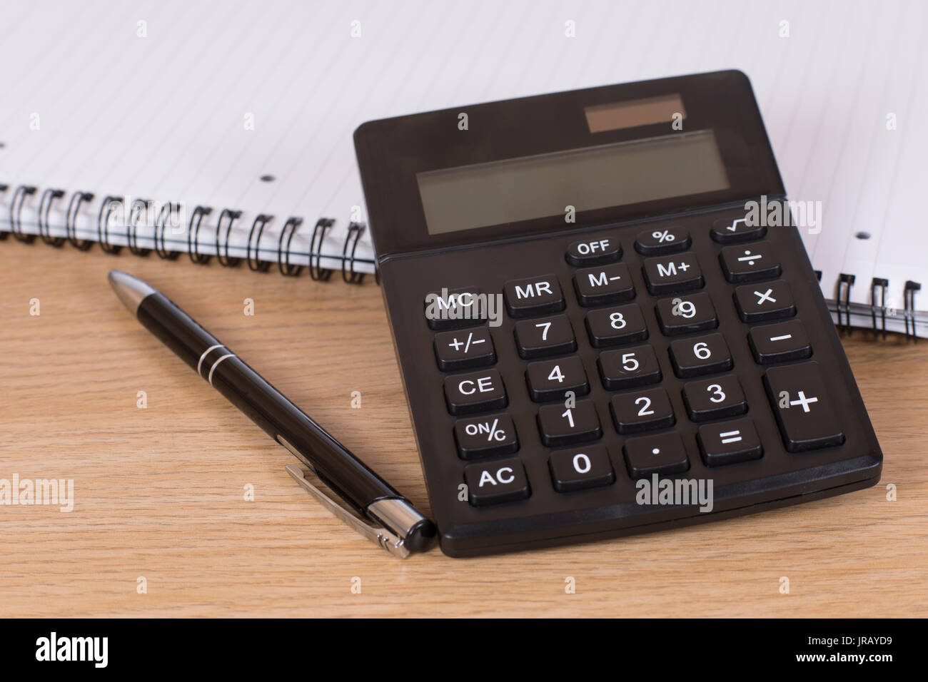 Business or education concept with calculator, ballpoint pen and blank ...