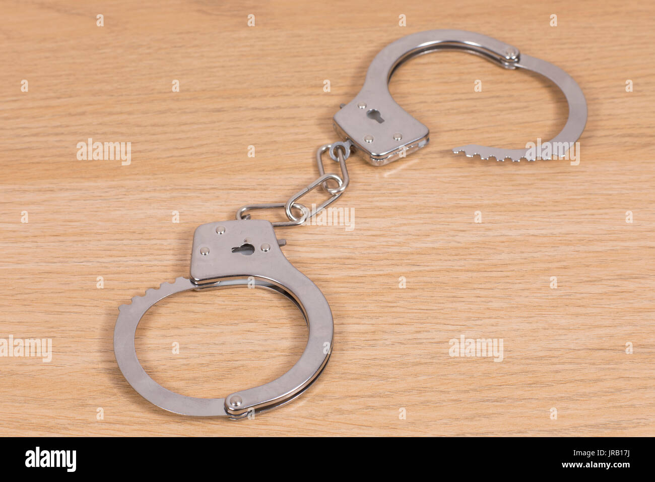 Open handcuffs hi-res stock photography and images - Alamy