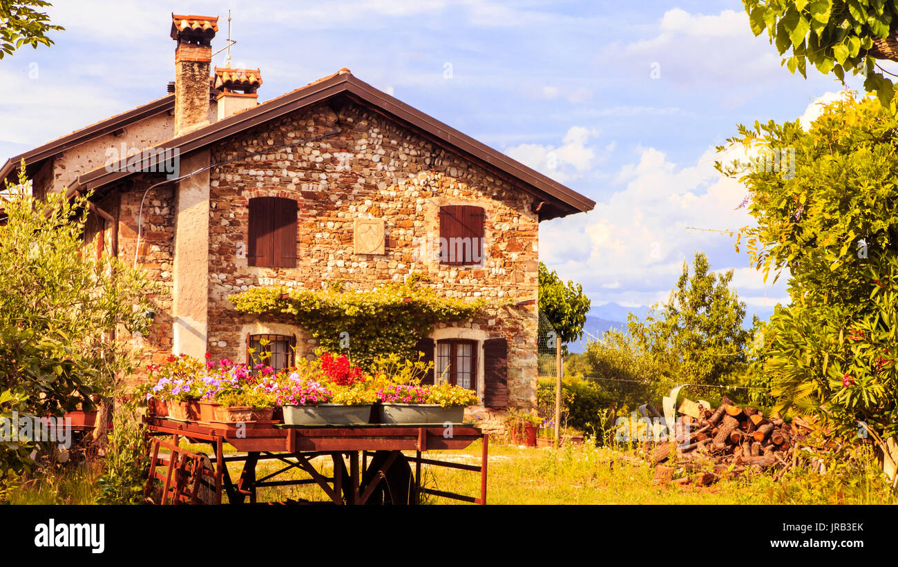 An old farm in the italian countryside with flowers in its garden Stock ...