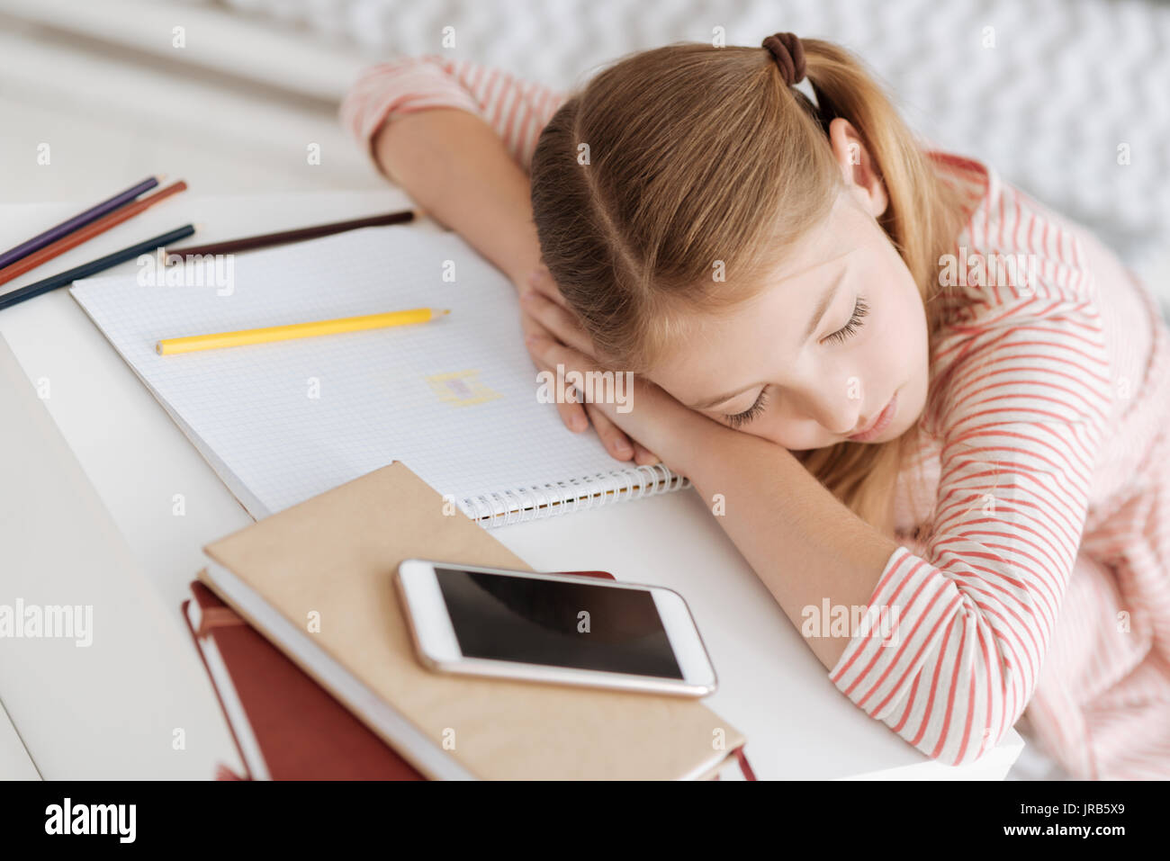 Exhausted child sleeping after drawing Stock Photo - Alamy