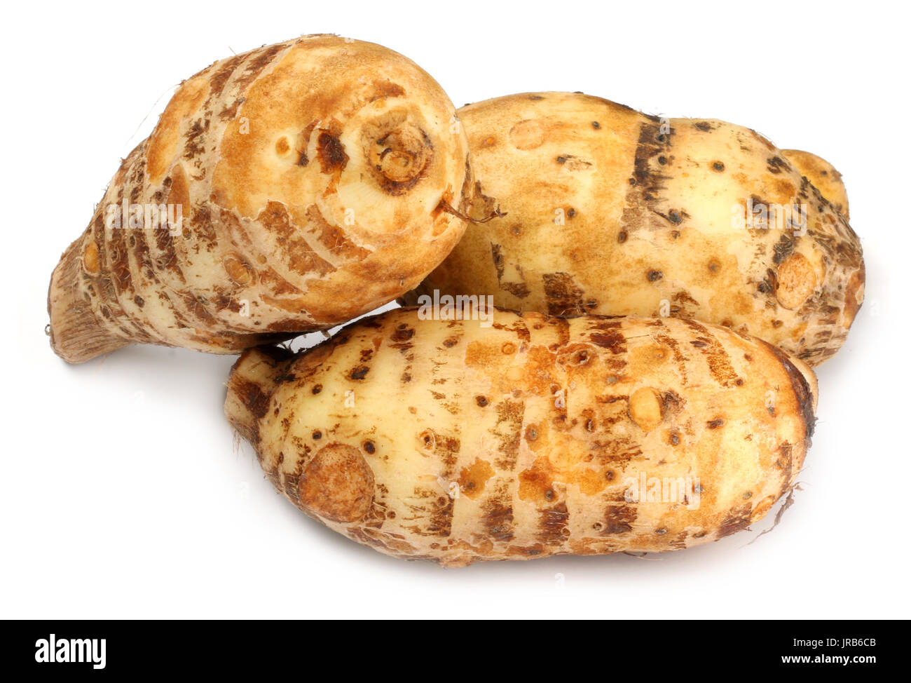 Edible taros over white background Stock Photo - Alamy
