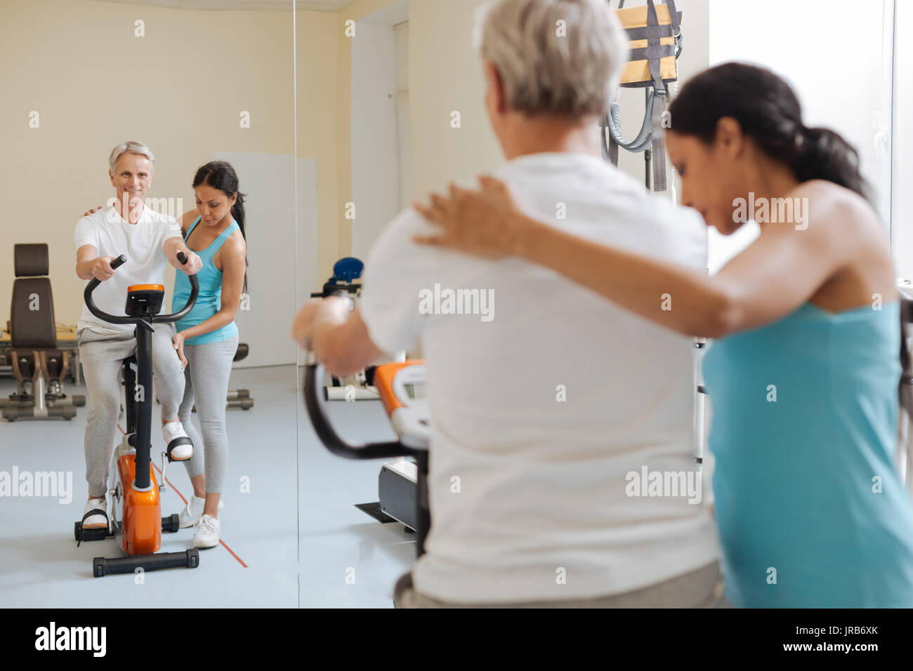 Attentive coach supporting her client Stock Photo - Alamy