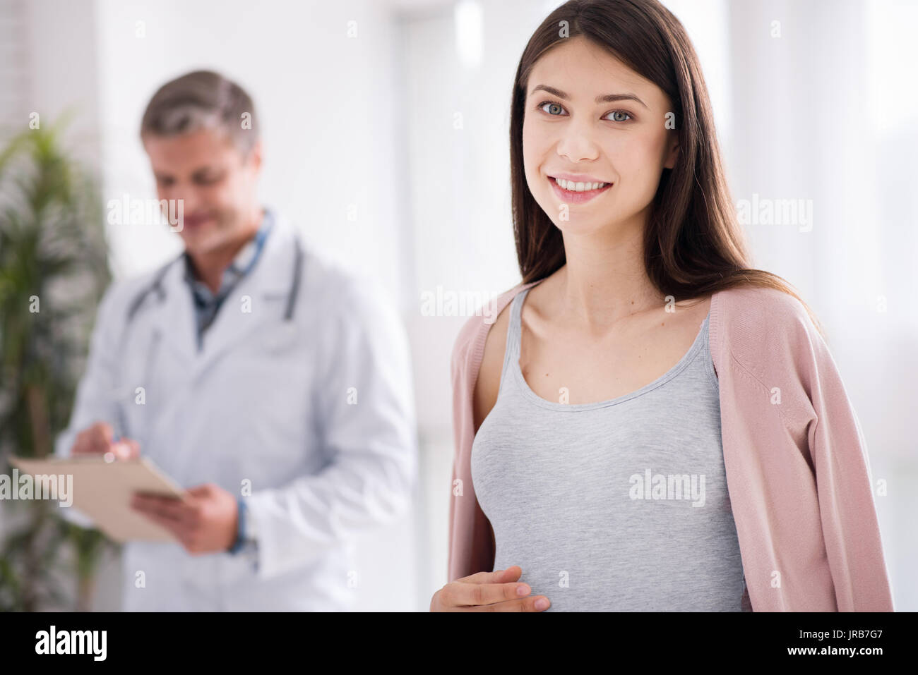 Delighted female person looking forward Stock Photo - Alamy