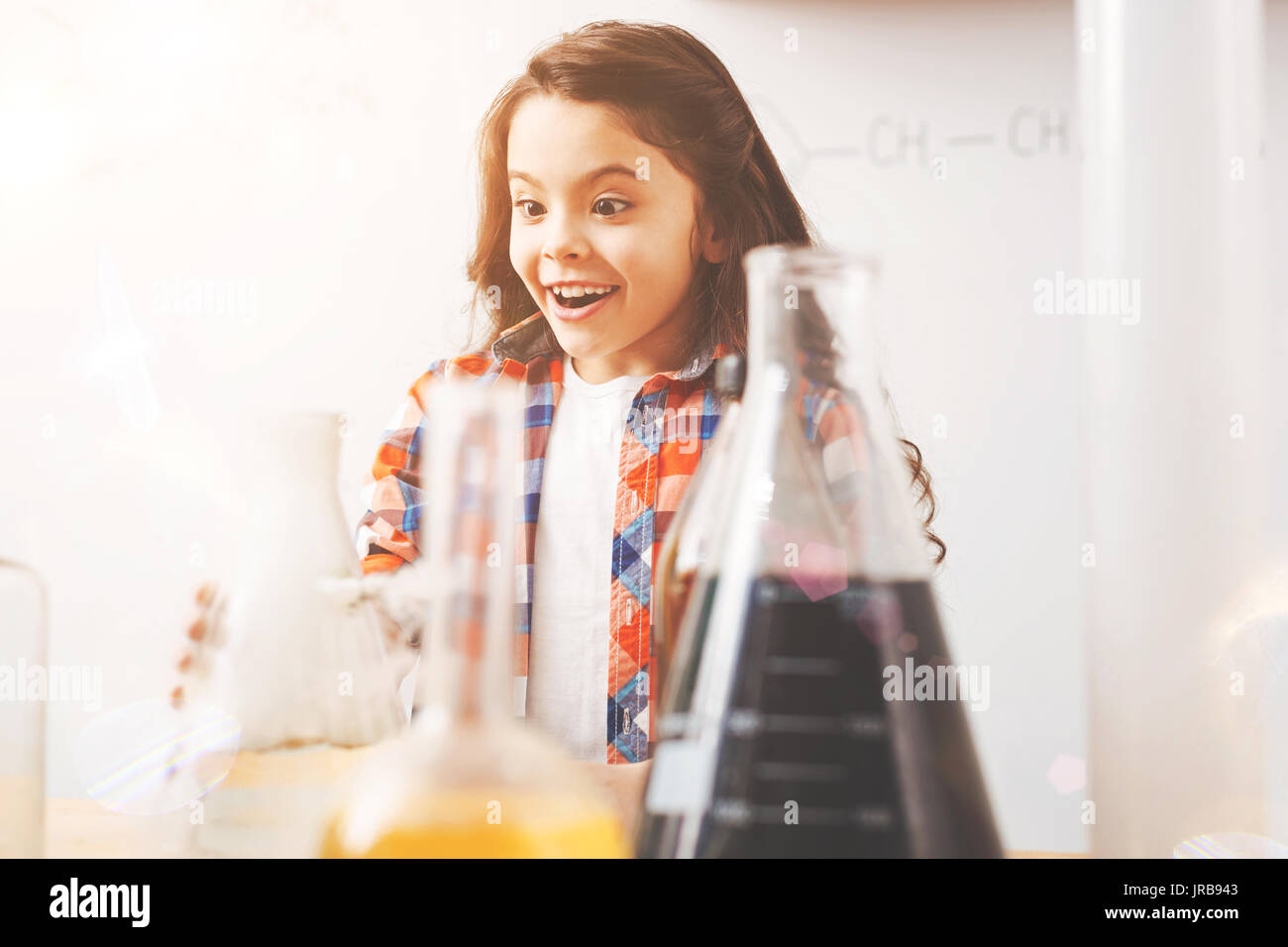 Positive delighted brunette opening her eyes widely Stock Photo - Alamy