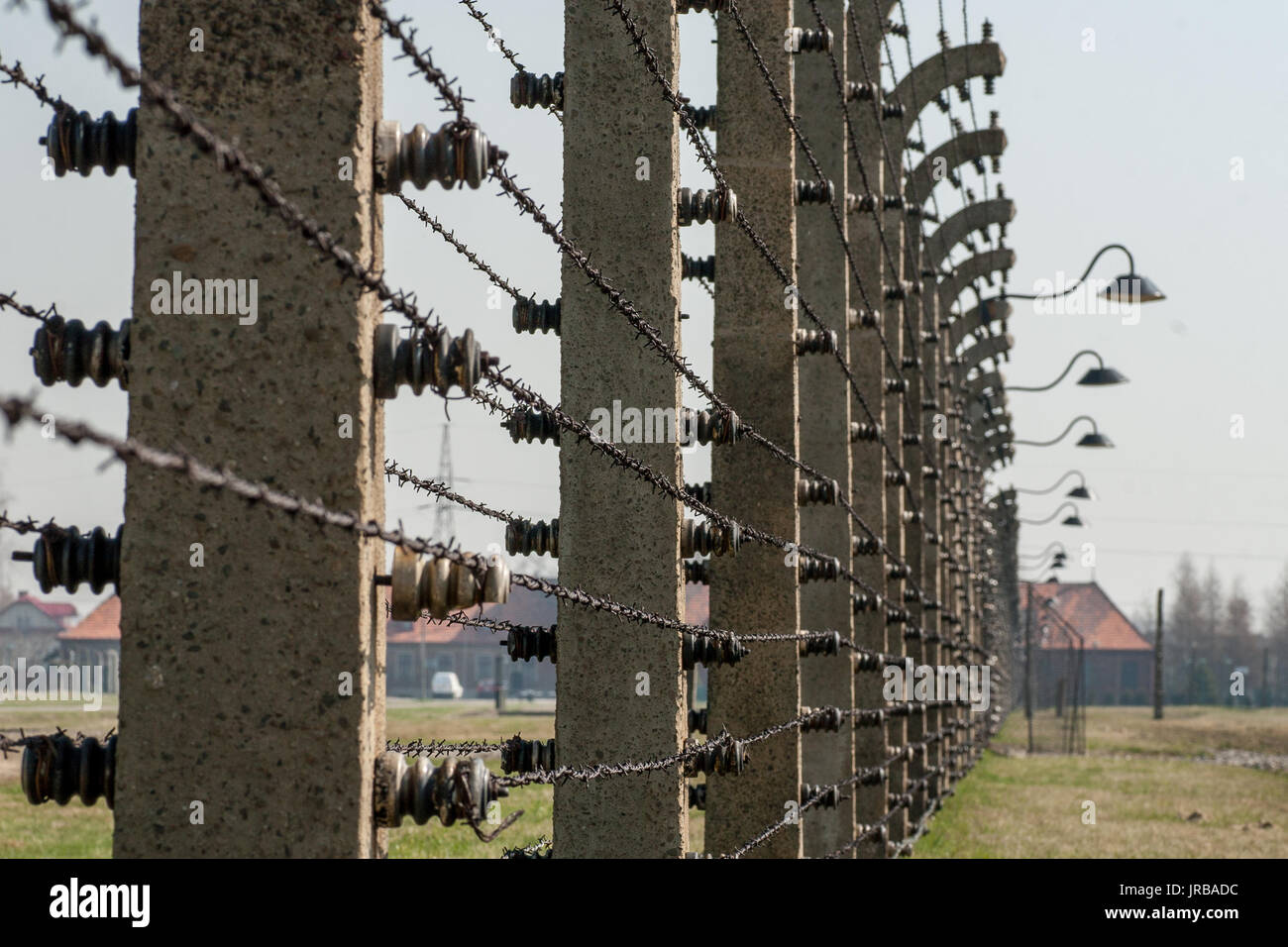 Electric barbed wire fence in former Nazi Concentration Camp Auschwitz ... Electric barbed wire fence in former Nazi Concentration Camp Auschwitz ...