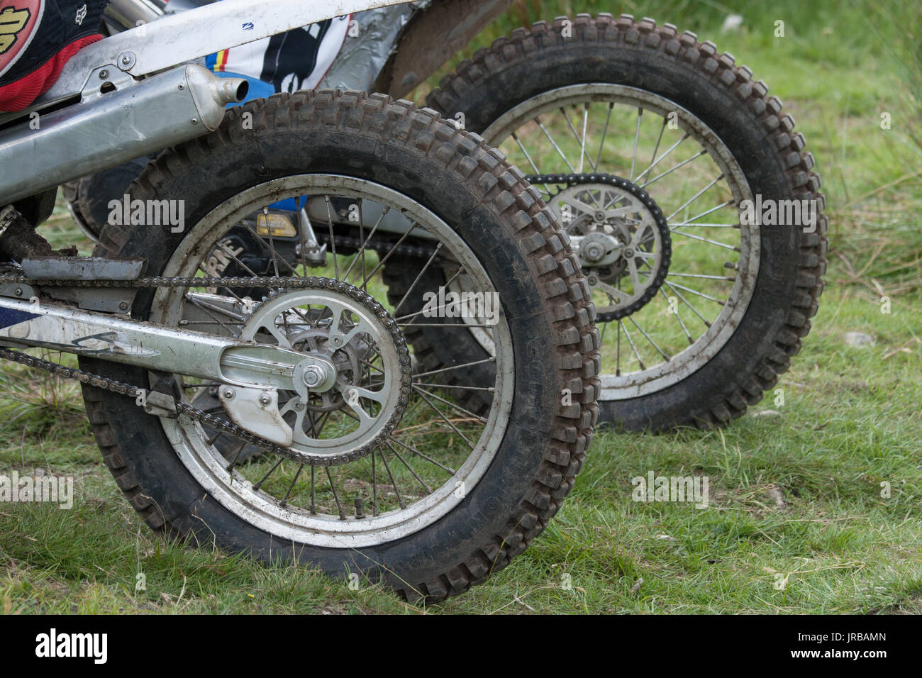 Rear wheels of cross motorbikes on a motocross trial near Brittas in ...