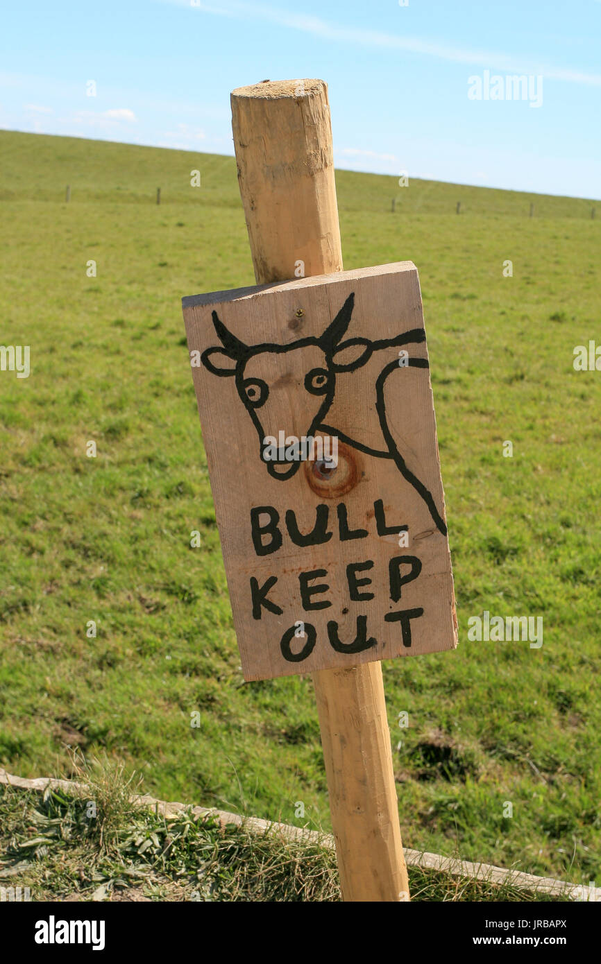 Wooden sign post, warning for tourists - bull keep out - at the Cliffs ...