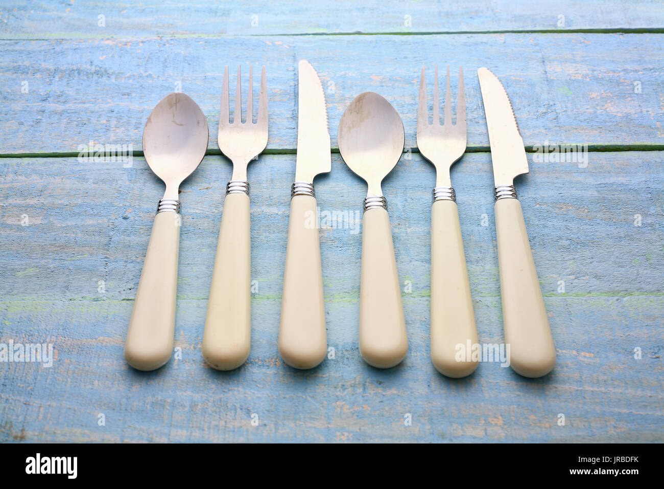 Cutlery on Wooden Background Stock Photo - Alamy