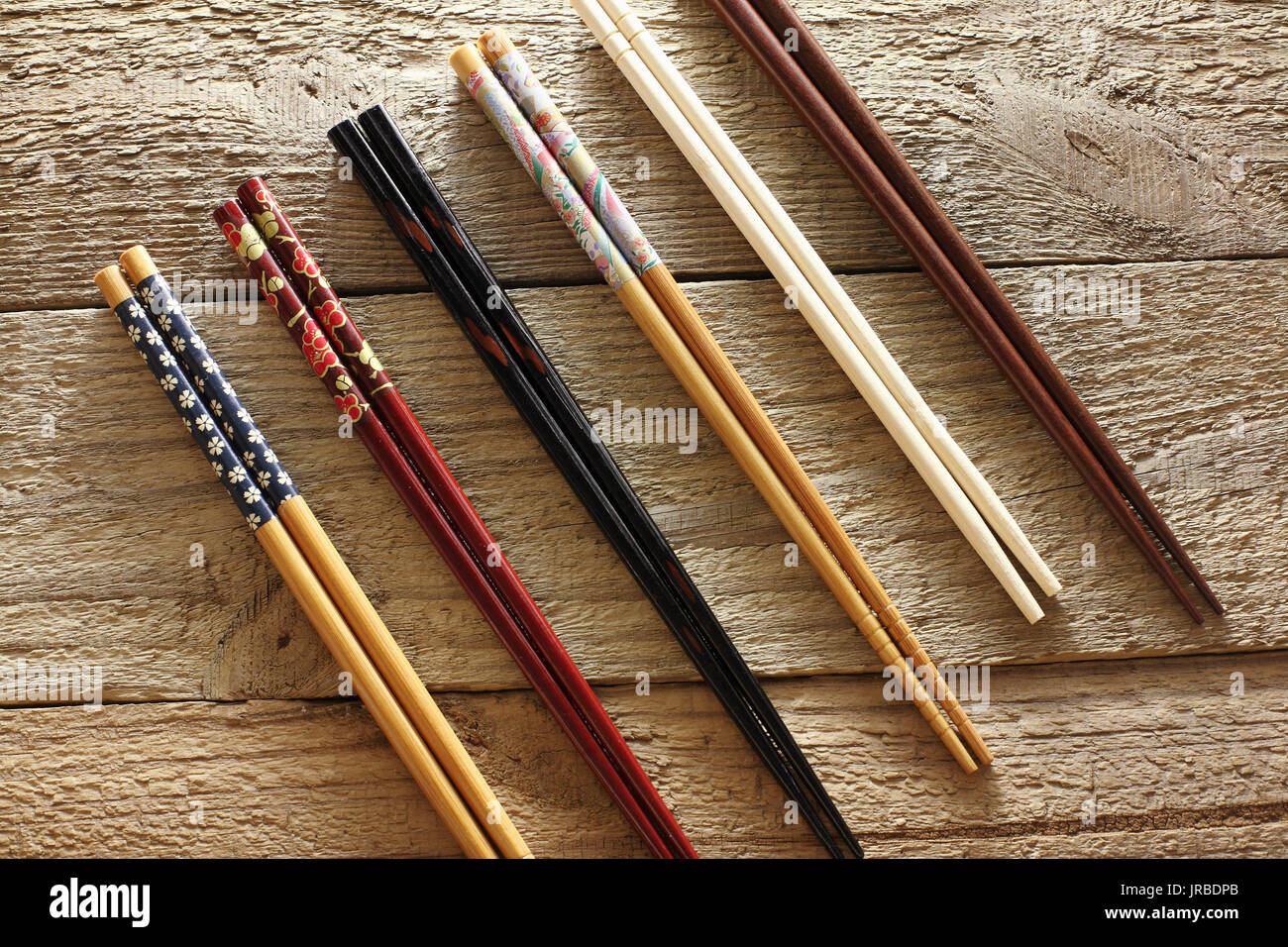 Chopsticks on Wooden Background Stock Photo - Alamy