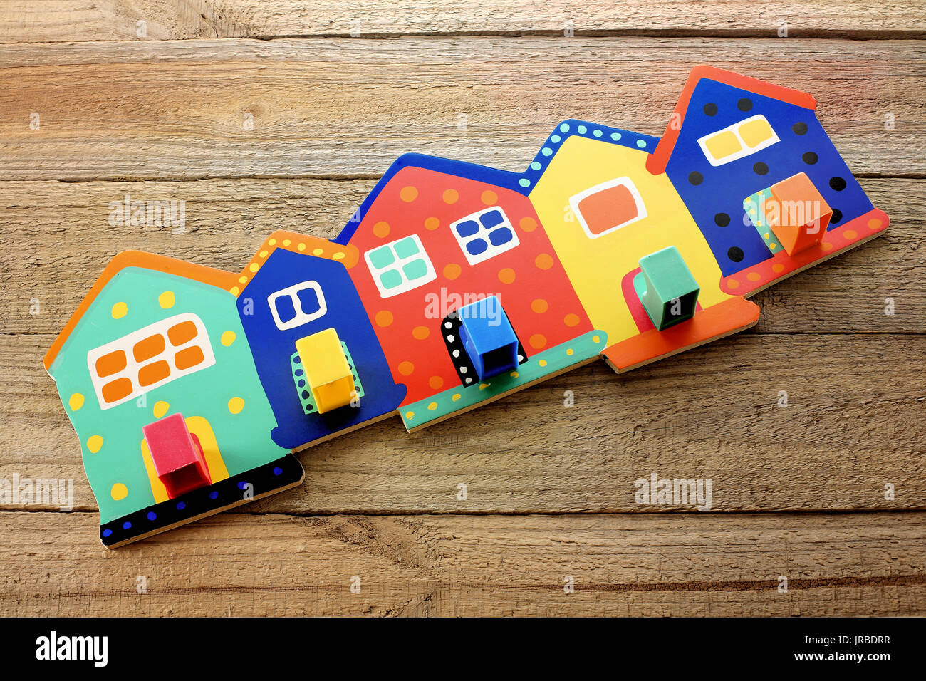 Toy Houses on Wooden Background Stock Photo - Alamy