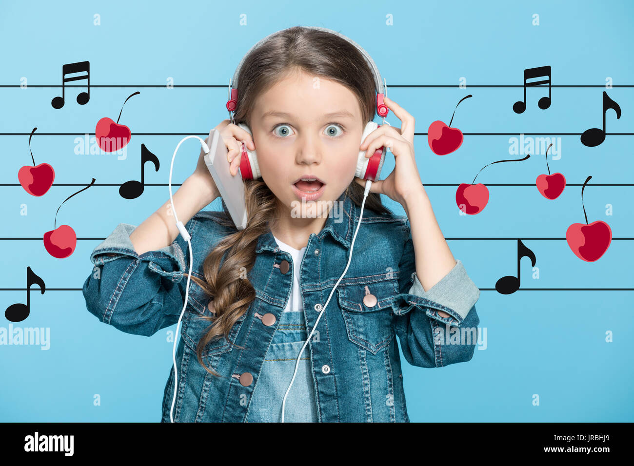 Adorable little girl in headphones Stock Photo - Alamy