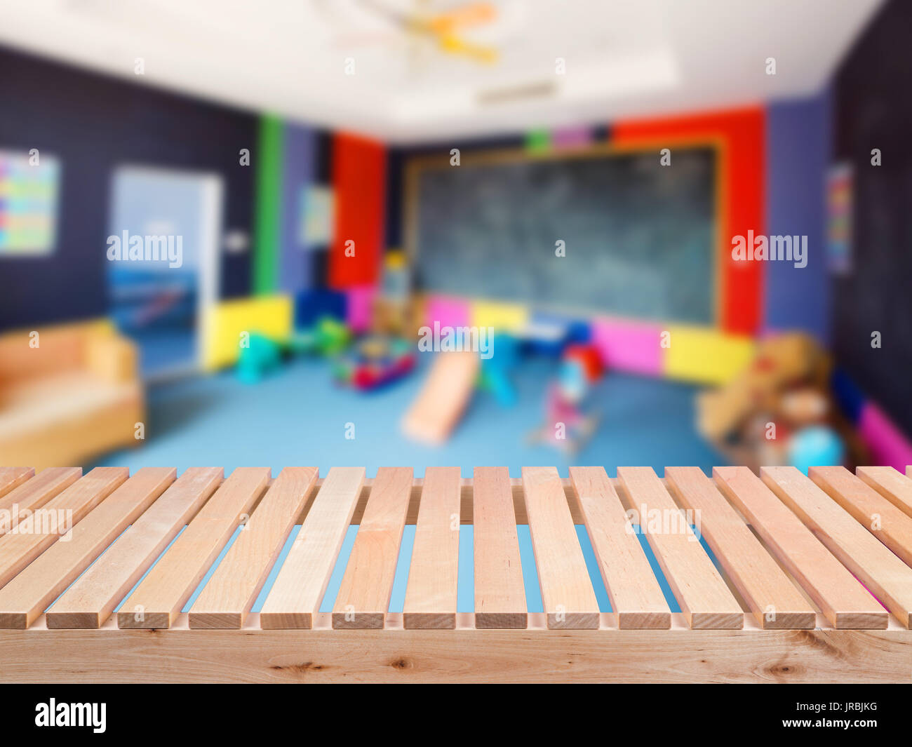 wooden bench with kids playground background Stock Photo - Alamy