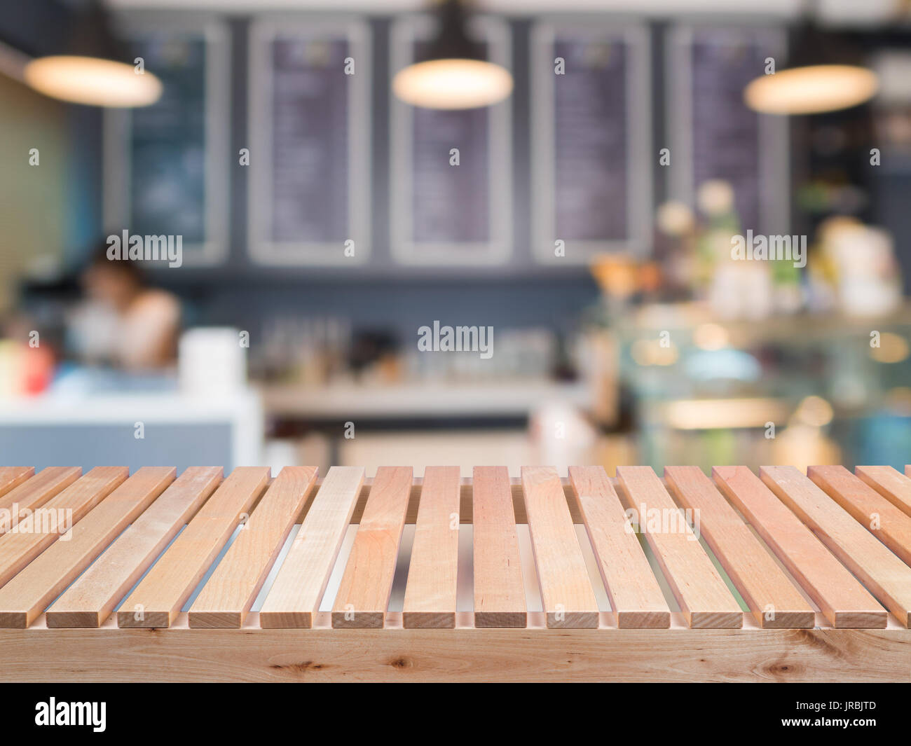 wooden counter top with coffee shop background Stock Photo - Alamy