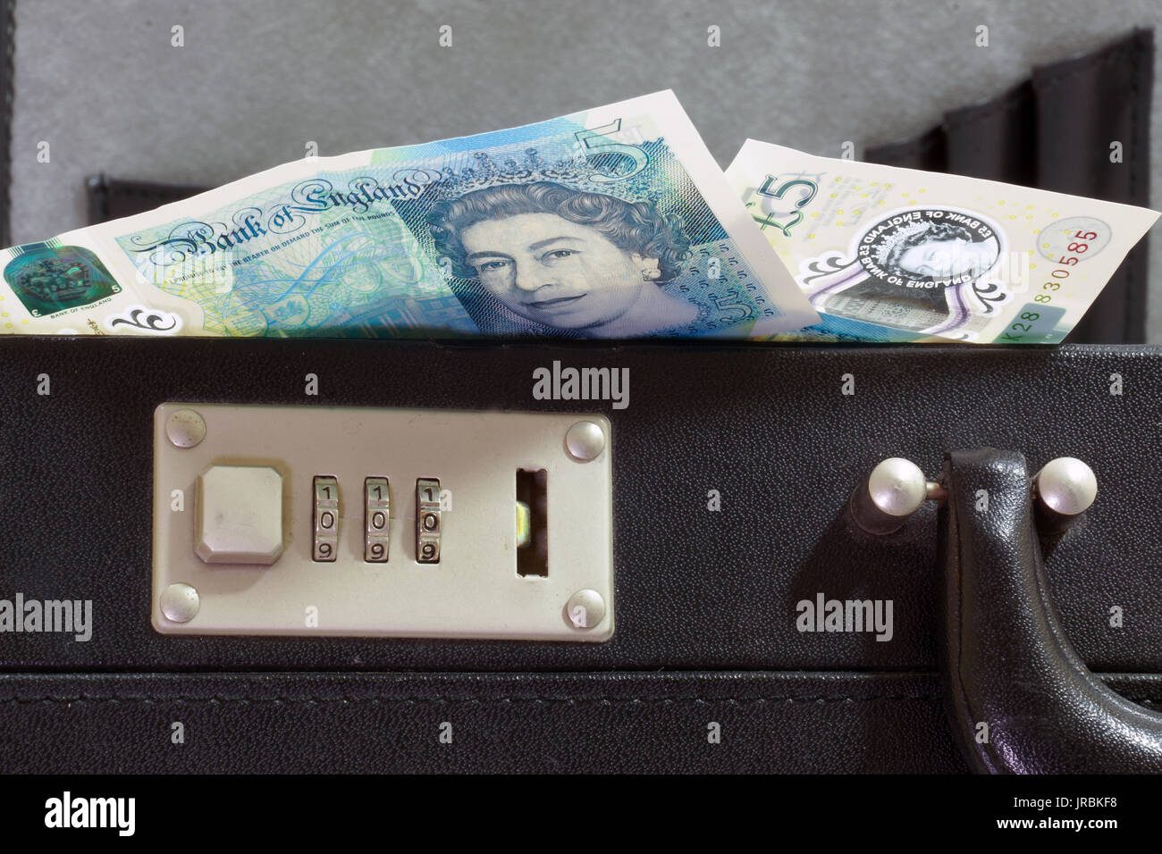 A briefcase full of the newly introduced currency of the United Kingdom ...