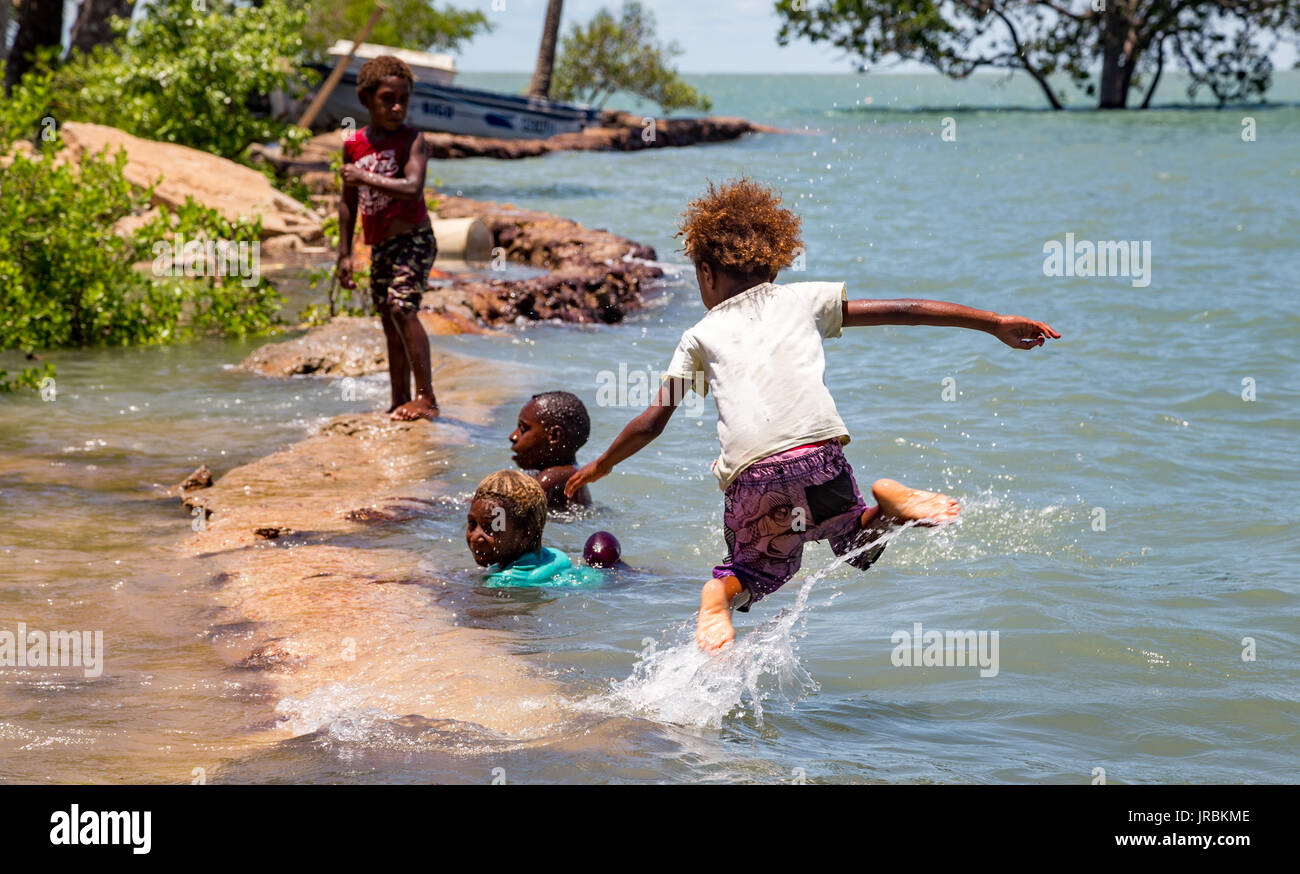 Torres Strait island children play in king tides off low-lying Saibai ...