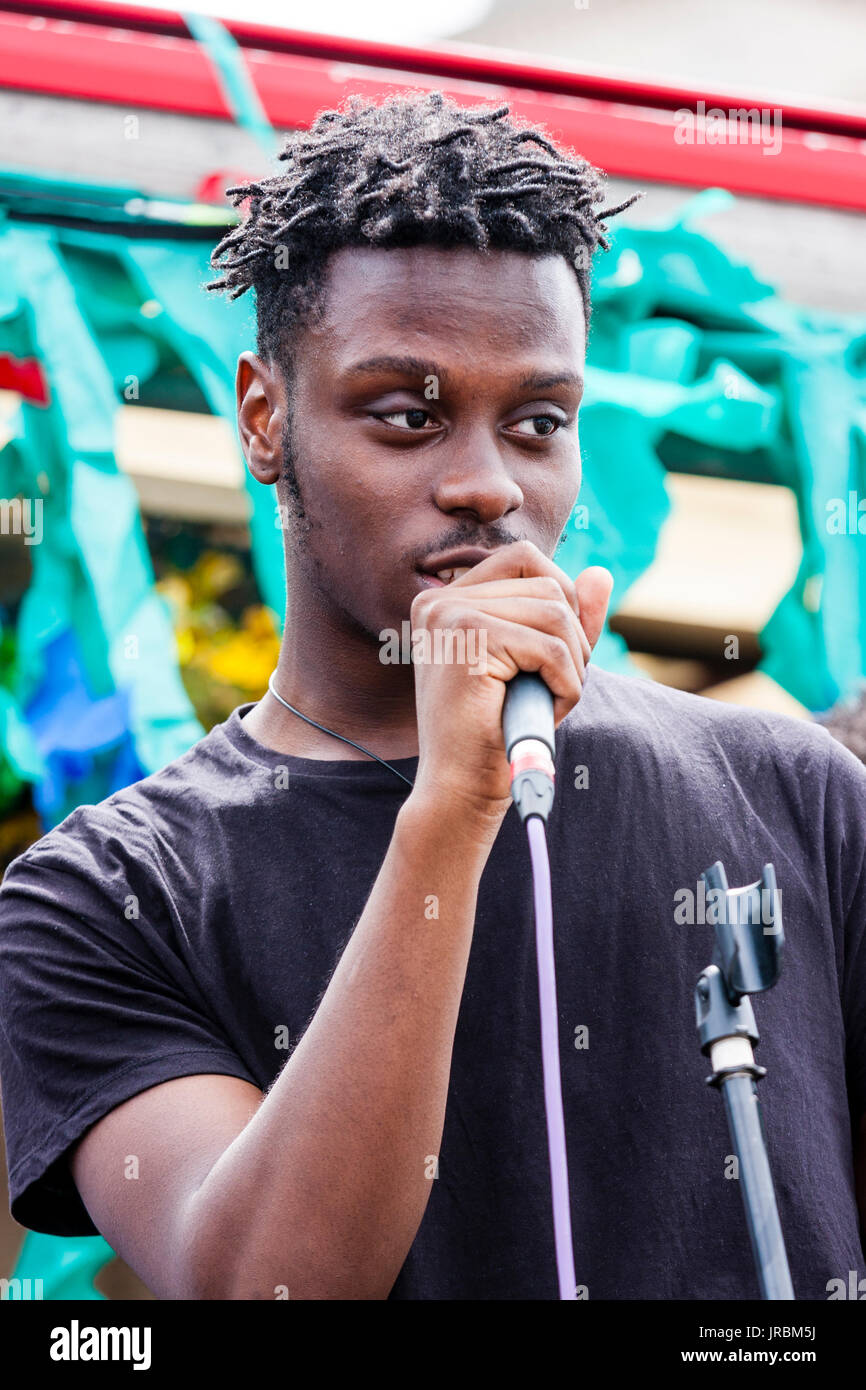 Afro singer holding microphone hi-res stock photography and images - Alamy