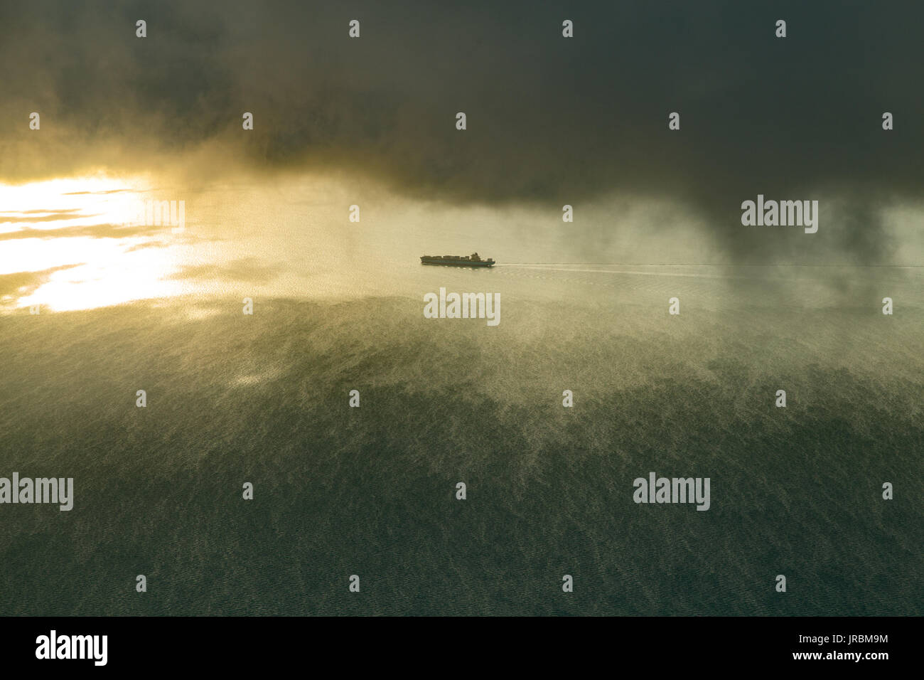 Freighter going through Torres Strait shipping channel in a storm Stock ...