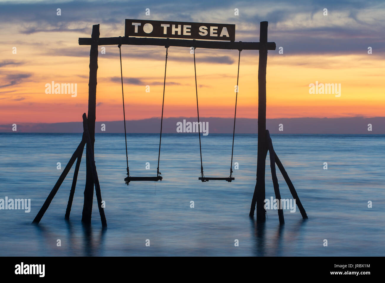 Tropical beach sunset swing hi-res stock photography and images - Alamy