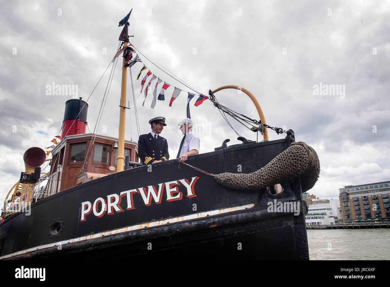 Commander Richard Pethybridge greets skipper of the ST Portwey, Tom ...