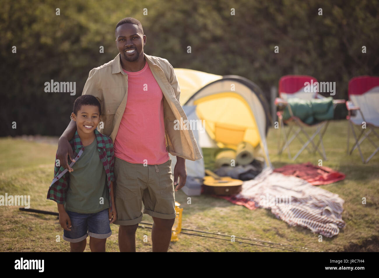 Smiling father son standing hi-res stock photography and images - Alamy