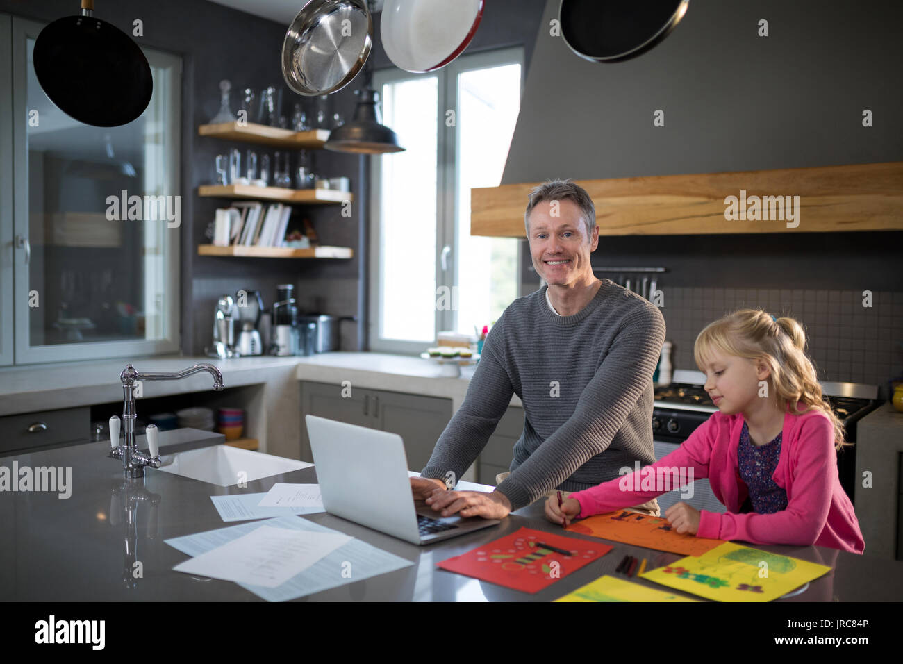 Father helping daughter in drawing hi-res stock photography and images ...