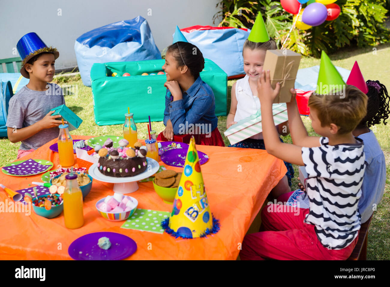 Happy children at birthday party in yard Stock Photo - Alamy