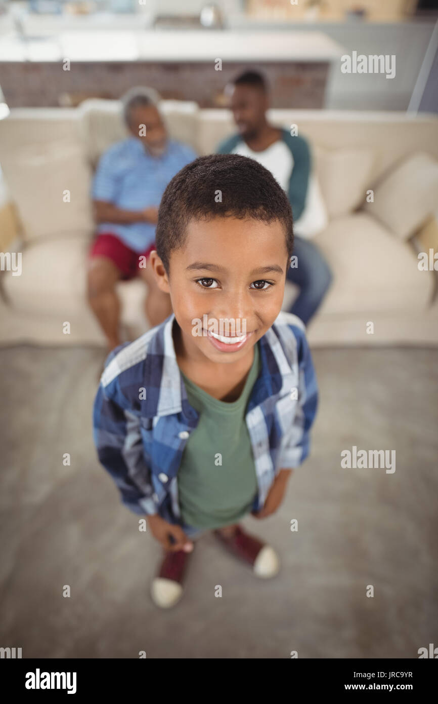 Portrait of smiling boy standing in living room at home Stock Photo - Alamy