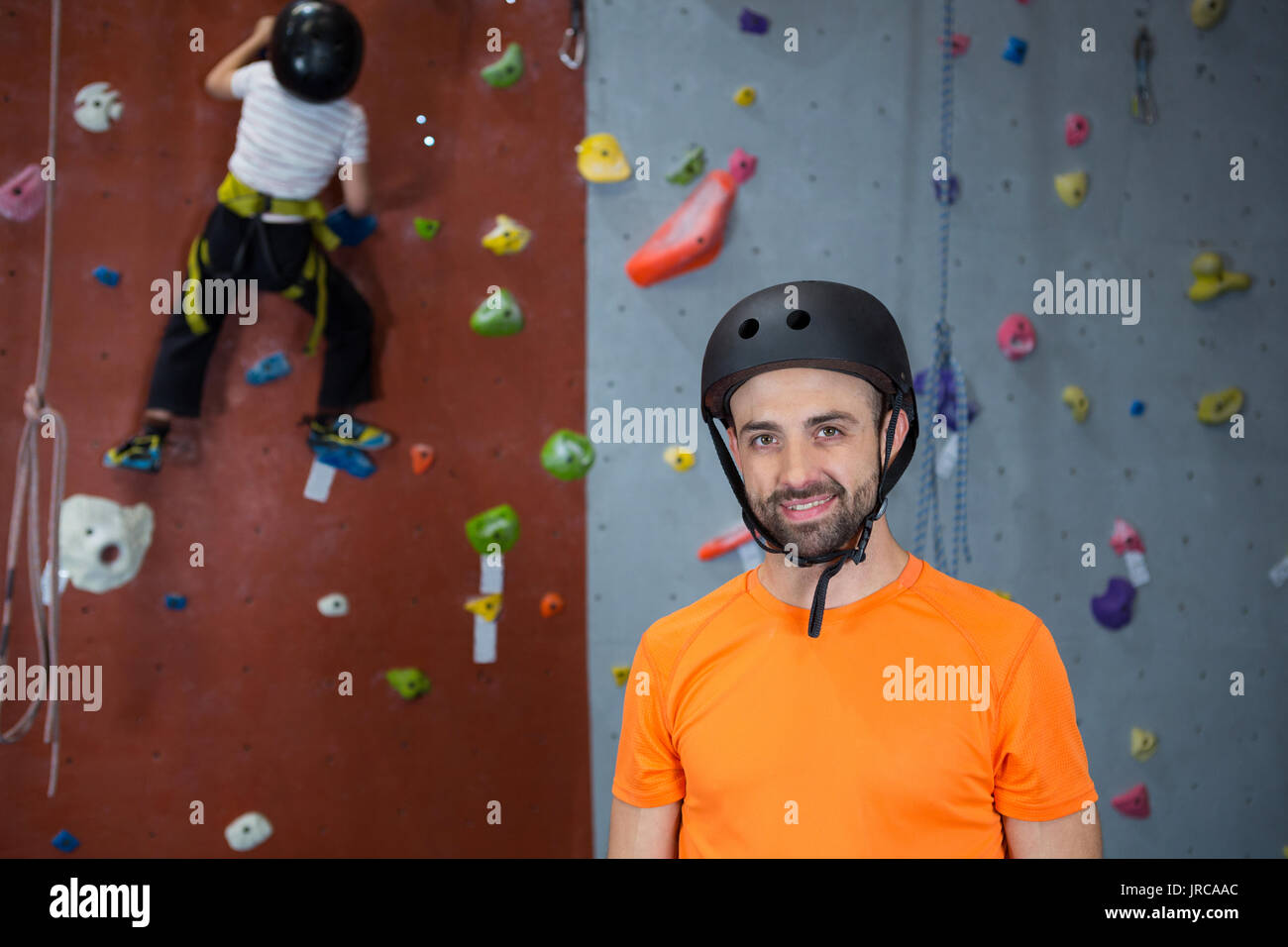 Portrait of trainer standing in fitness studio Stock Photo - Alamy
