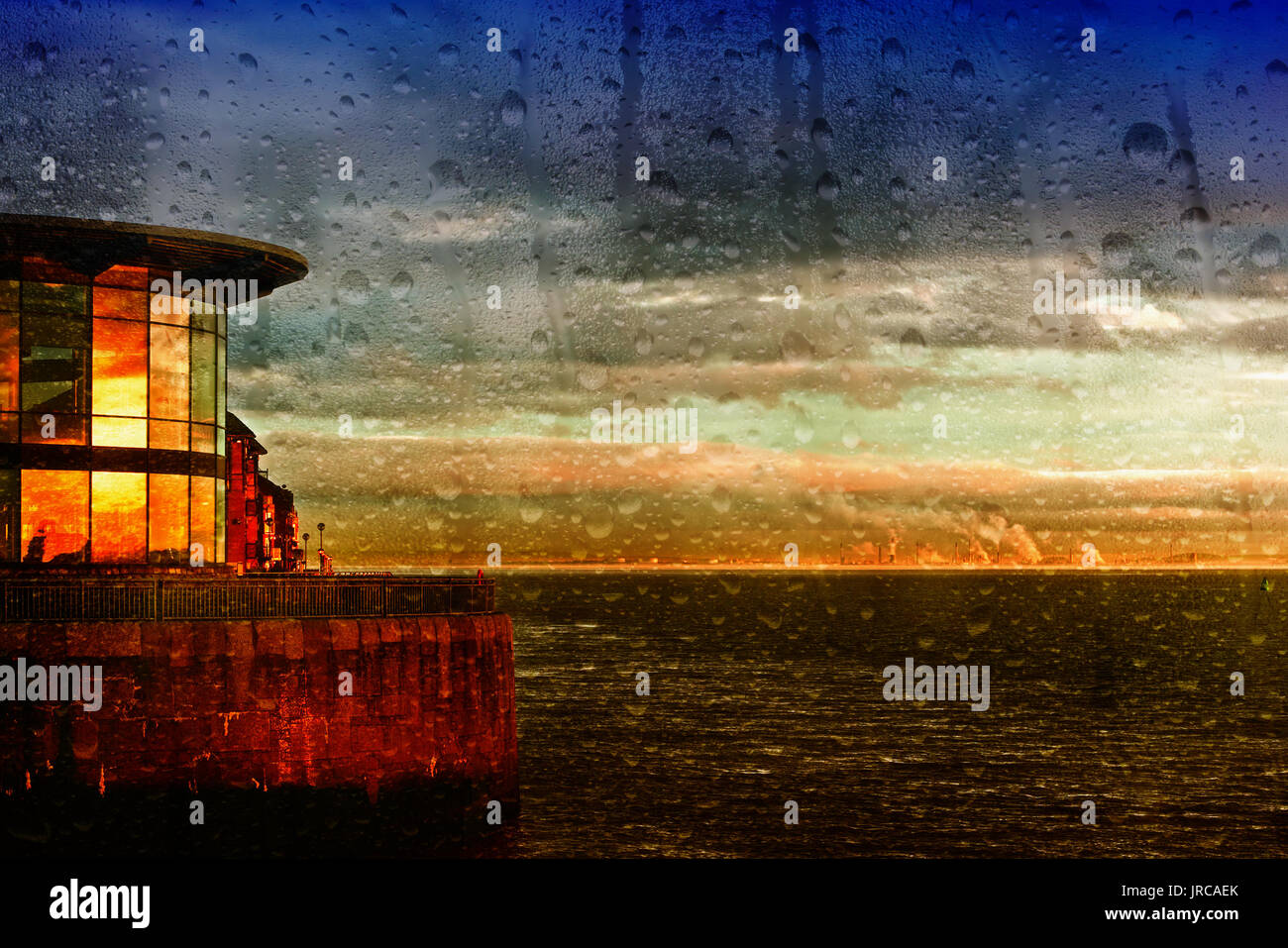 Looking through a misty window with raindrops at the River Mersey ...