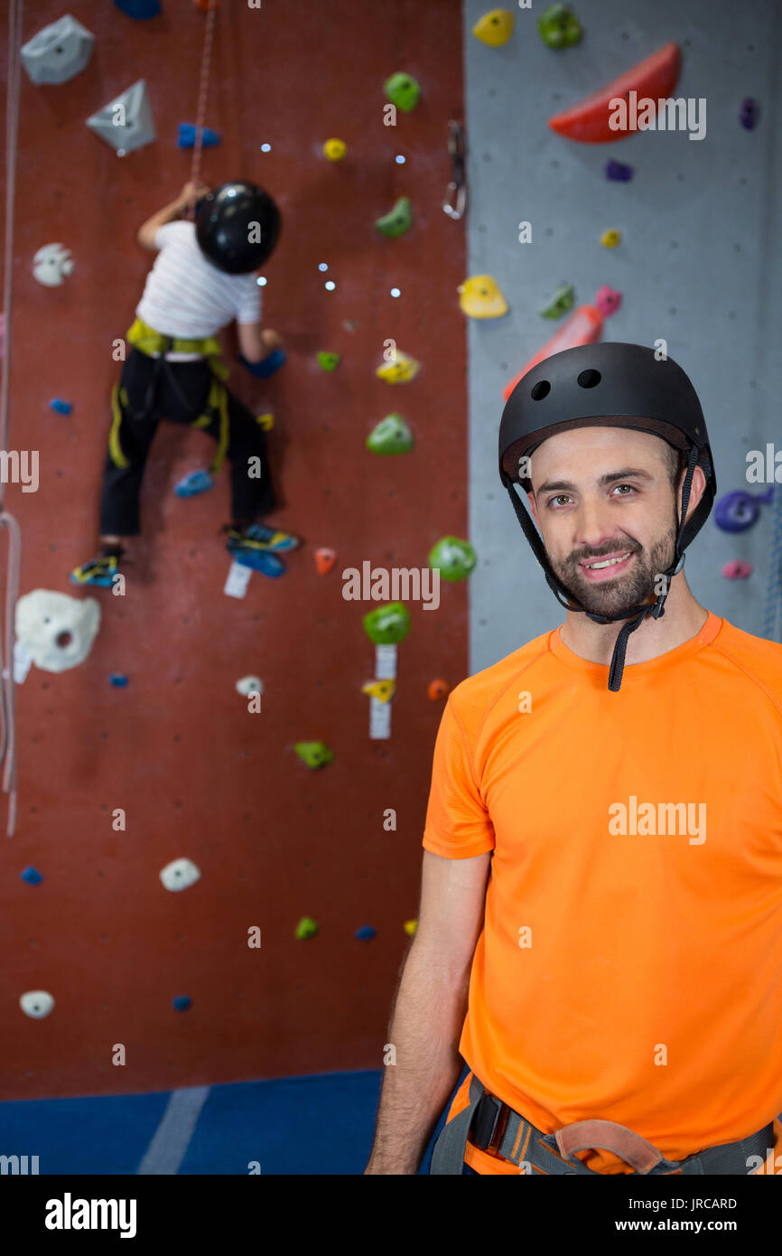 Portrait of trainer standing in fitness studio Stock Photo - Alamy