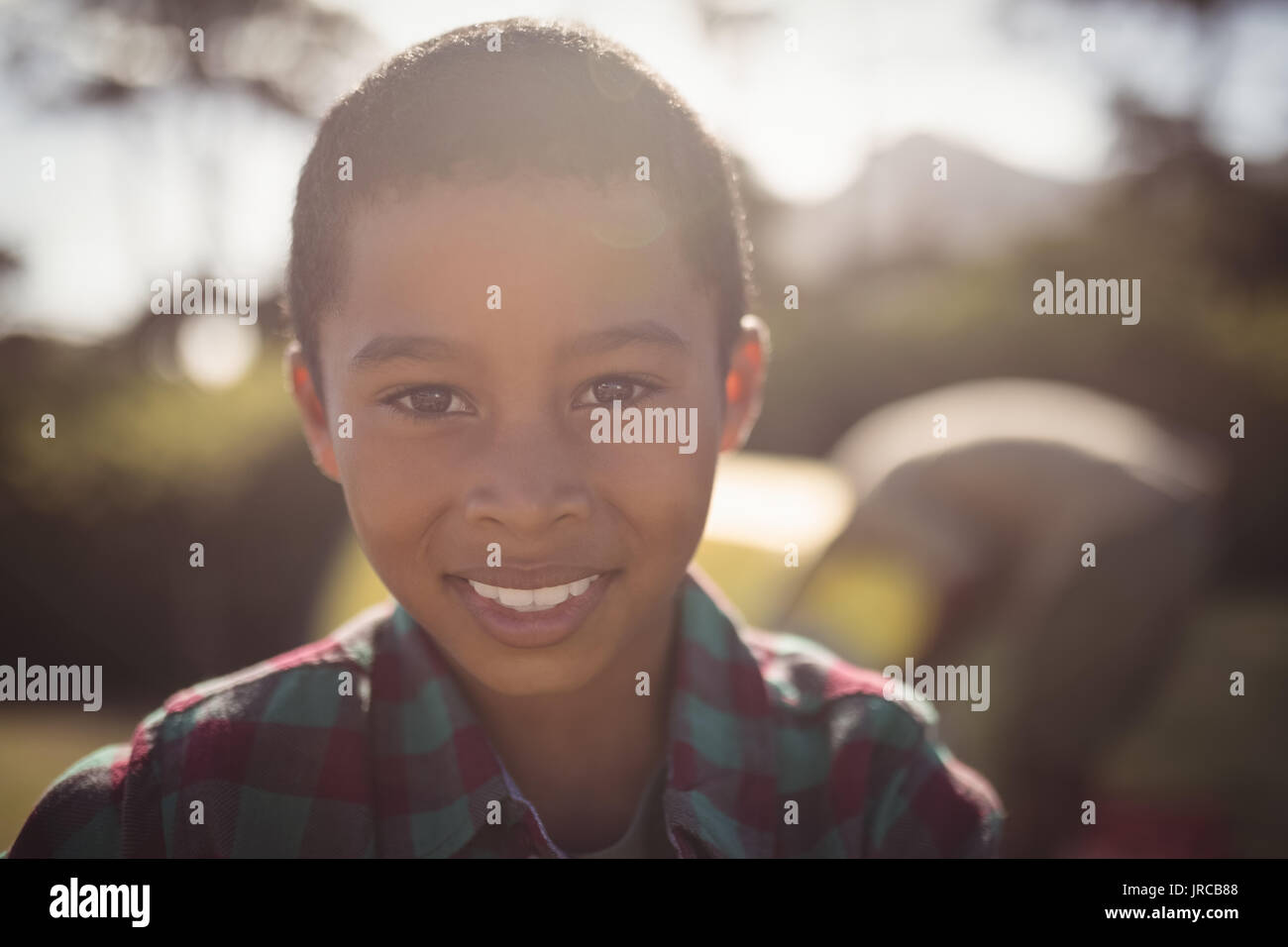 Close-up of smiling boy looking at camera Stock Photo - Alamy