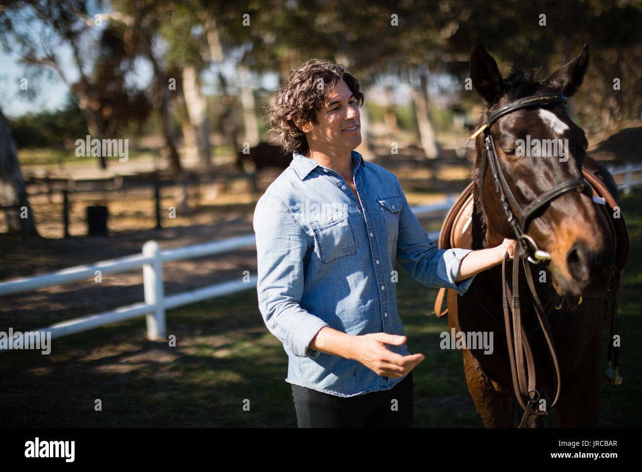 Man Holding Horse On Field High Resolution Stock Photography and Images ...