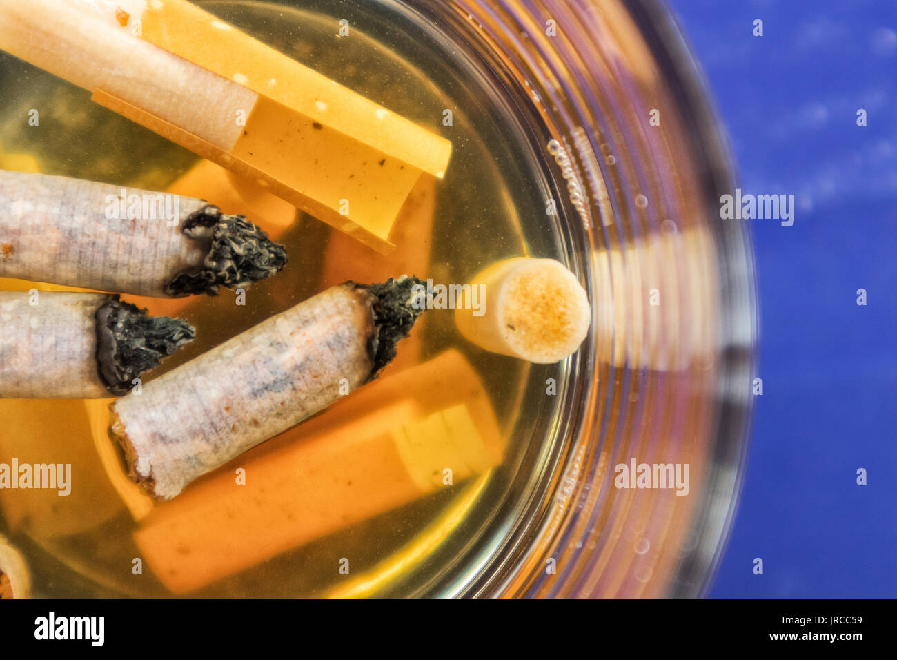 Cigarette soaked in water Stock Photo - Alamy