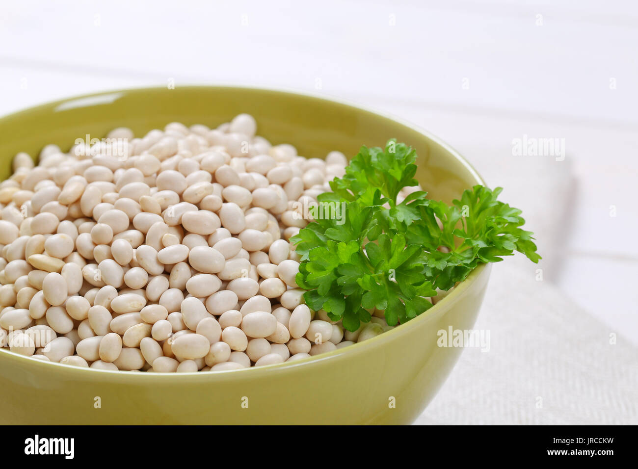 bowl of raw white beans - close up Stock Photo - Alamy