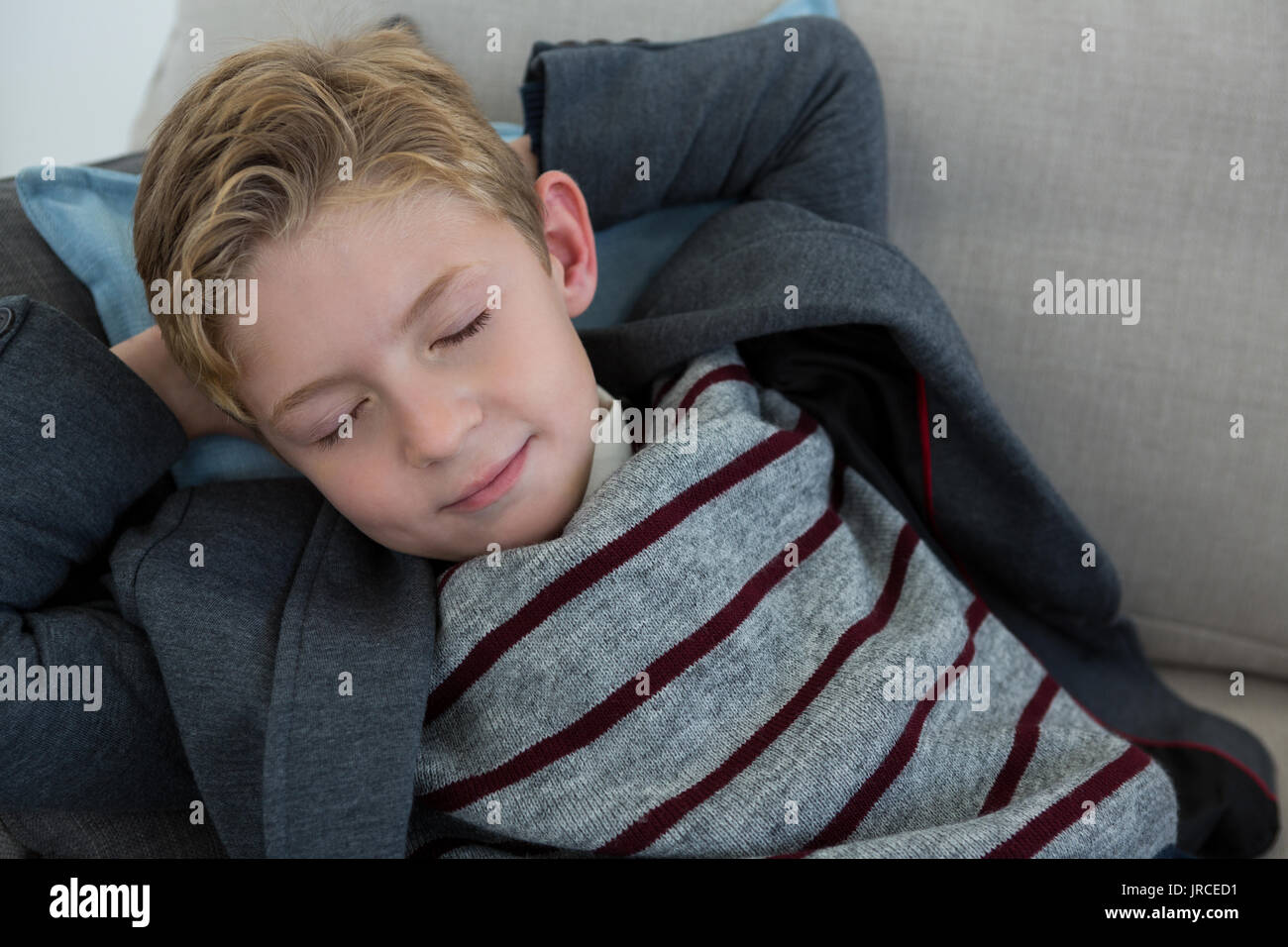 Little boy napping on couch Stock Photo - Alamy